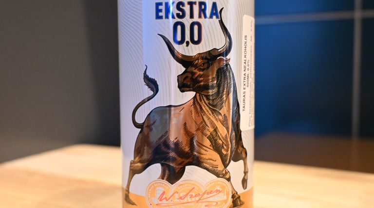 Lithuanian Tauras beer and cabbage rolls with tomato sauce